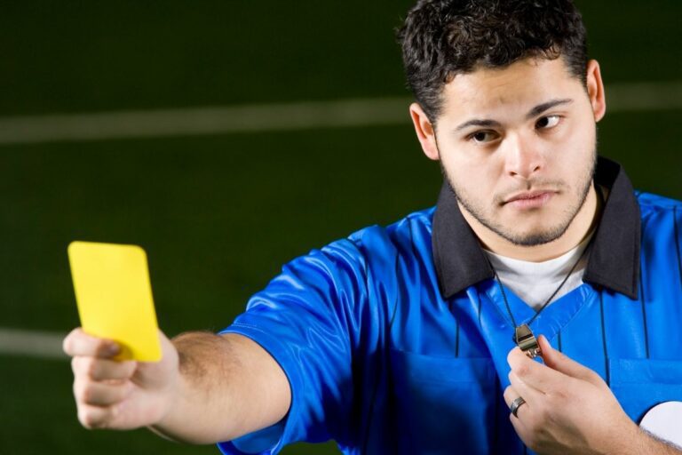 What Do Referees Write on Yellow Cards? Explained - The Whistle Line
